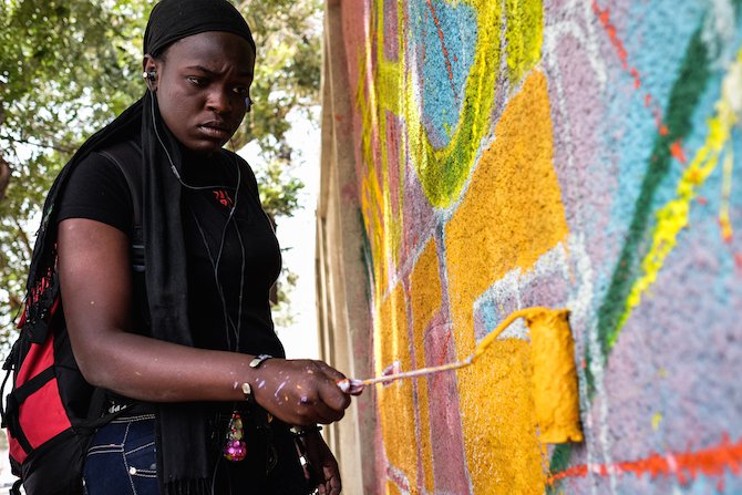 Breaking down walls by painting them: Senegal’s first lady of graffiti ...