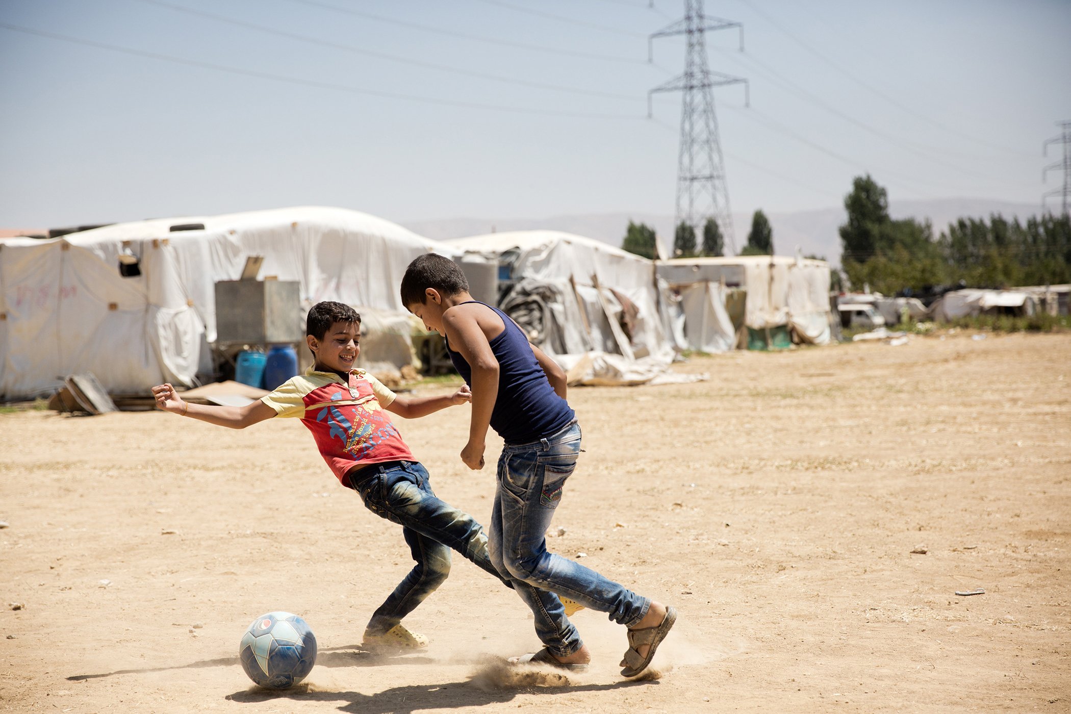 23 Photos of Kids Escaping Places of Crisis by Playing Soccer