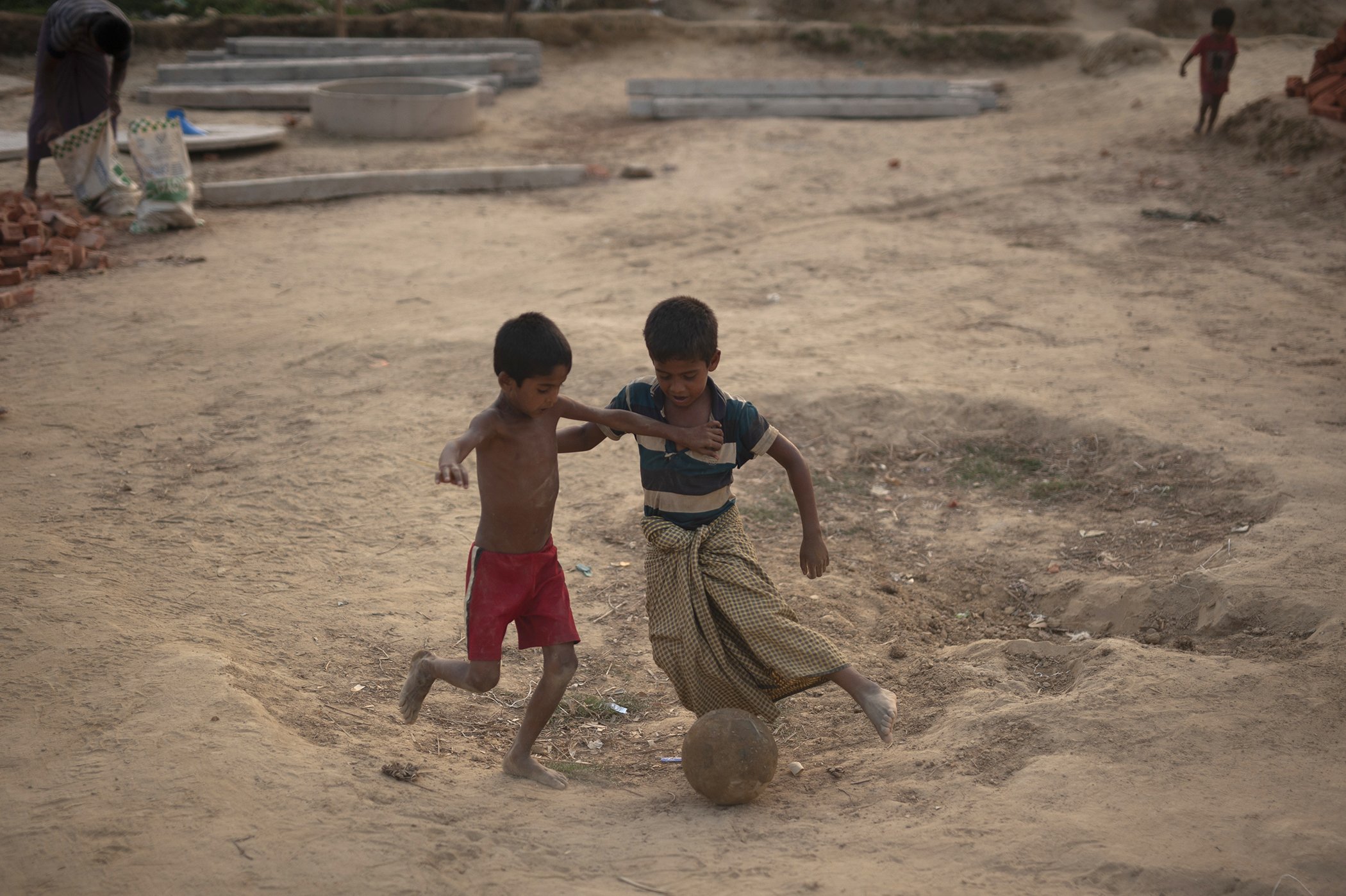 23 Photos of Kids Escaping Places of Crisis by Playing Soccer