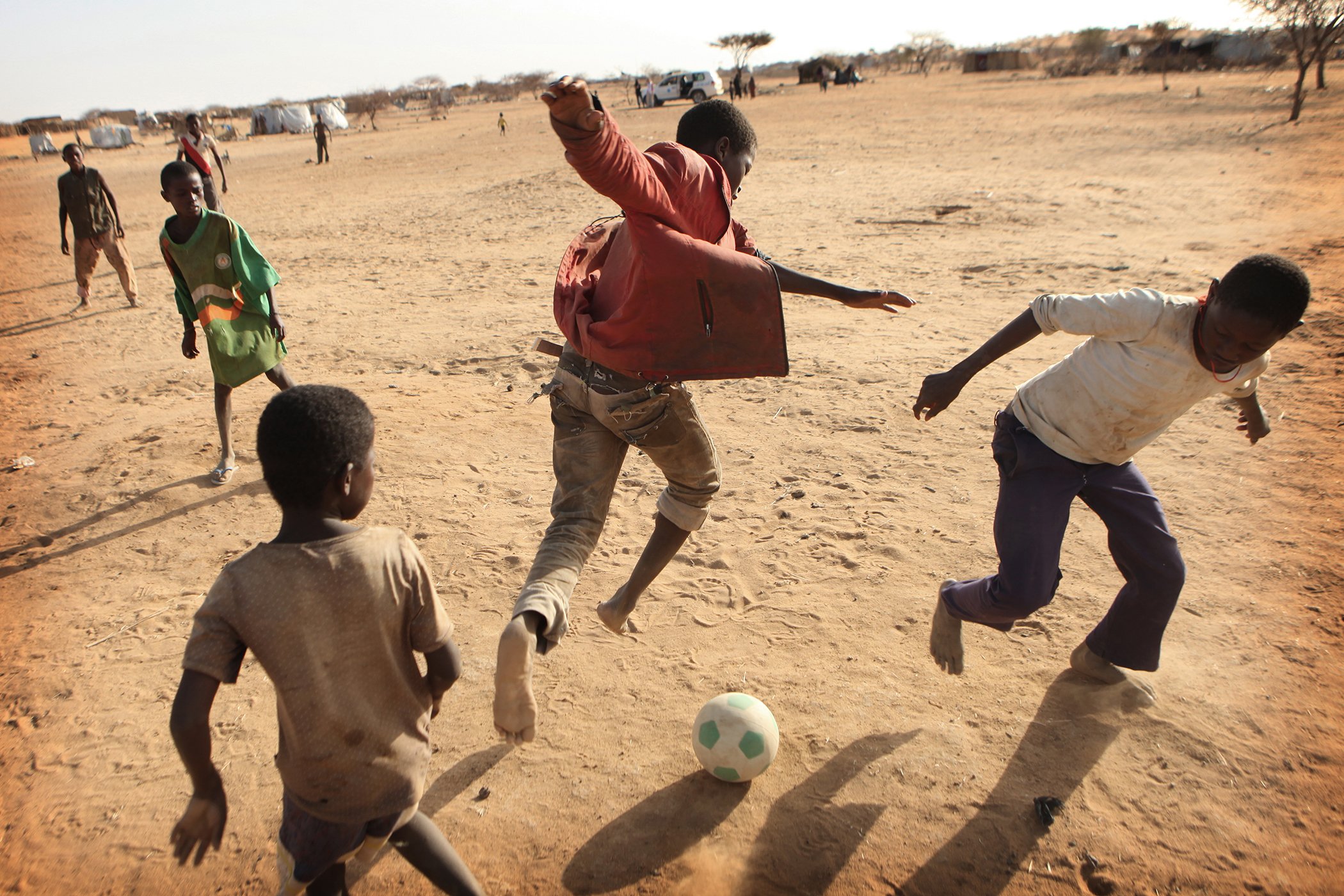 23 Photos of Kids Escaping Places of Crisis by Playing Soccer